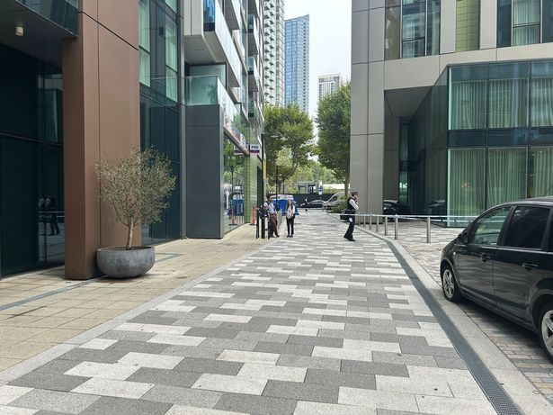 Woman in 20s dies after fall 'from height' near Canary Wharf tower ...